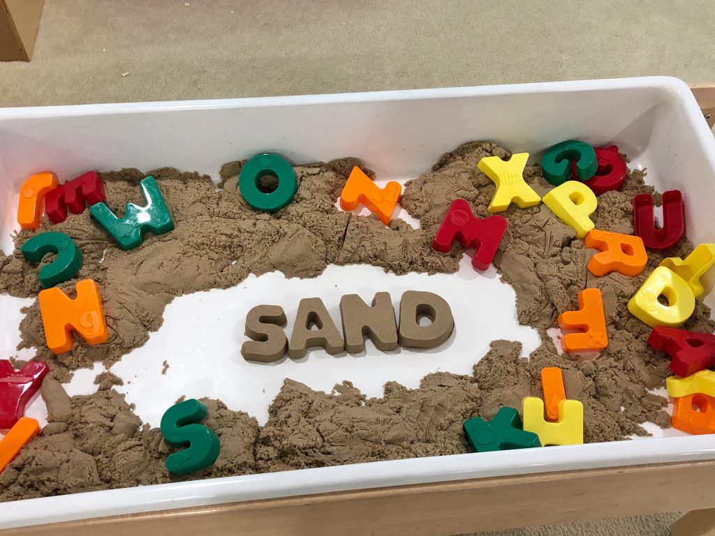 Sensory Table Kinetic Sand Letter Molds - Play to Learn Preschool